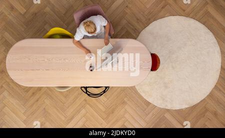 An aerial view of a large white contemporary house in geometric shapes ...