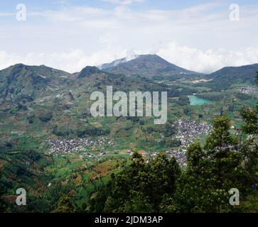 Landscape of Dieng plateau with mountain background and blue sky Stock ...