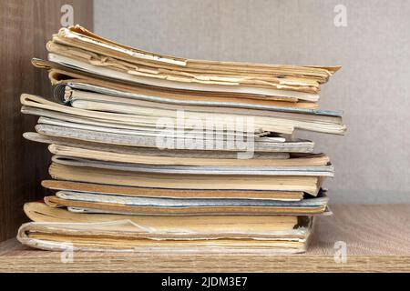 Stacked old notepads shelf Stock Photo - Alamy