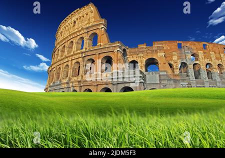 Ancient Rome: Colosseum in the grassland with country road and blue sky ...