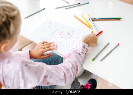 White blonde girl drawing during class in art school indoors Stock ...