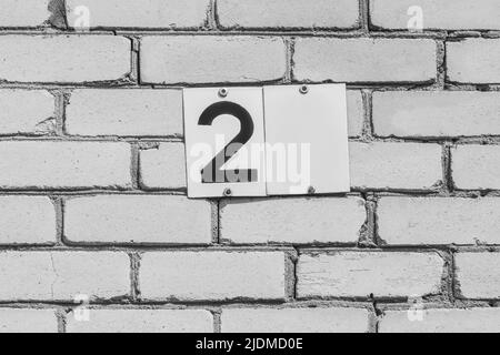 Street number sign on the wall Stock Photo - Alamy