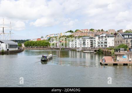 Narrow boat navigating through Bristol Docks Stock Photo - Alamy