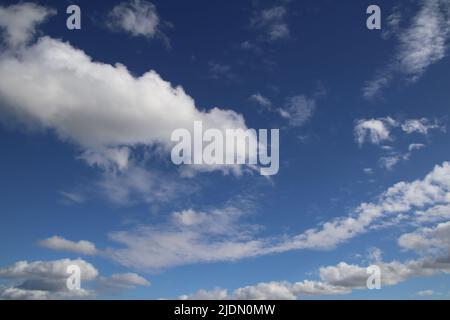 Cartoon Sun with clouds on blue sky - vector illustration Stock Photo ...