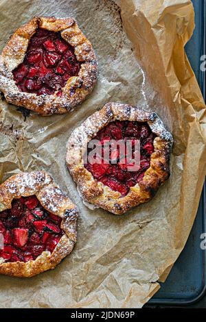 French dessert Galette with shortbread and strawberries. Open pie with ...