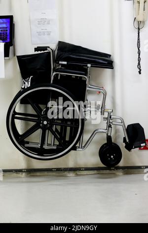 wheelchair and fire extinguisher Stock Photo - Alamy