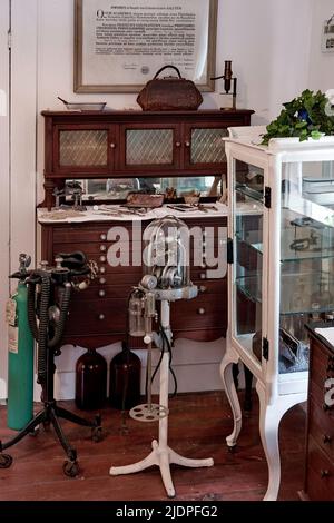 Old-fashioned doctor at his desk with antique medical equipment Stock ...