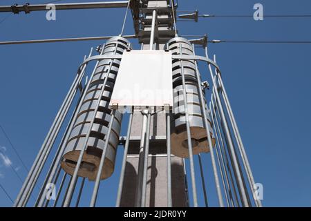 Railway overhead electric line counterweight blocks Stock Photo - Alamy