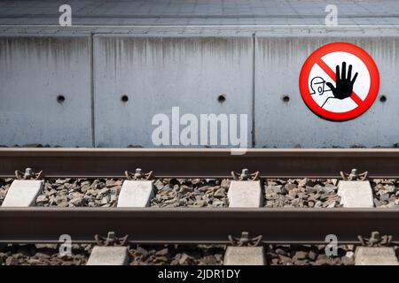 clearly visible danger sign stop danger with railroad tracks rails and ...