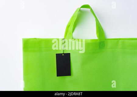 Blank paper tag with shopper paperbag on white background Stock Photo ...