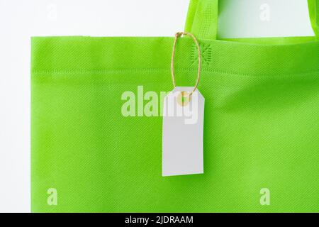 Blank paper tag with shopper paperbag on white background Stock Photo ...