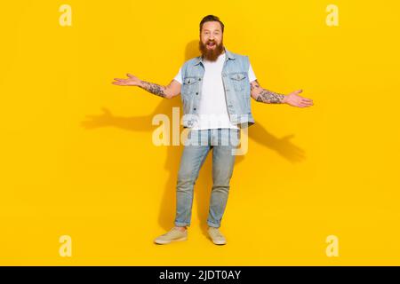 Photo of impressed funny guy dressed white shirt playing modern gadget ...