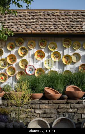 Enamelware used basin with patterns on wooden wall of house used as ...