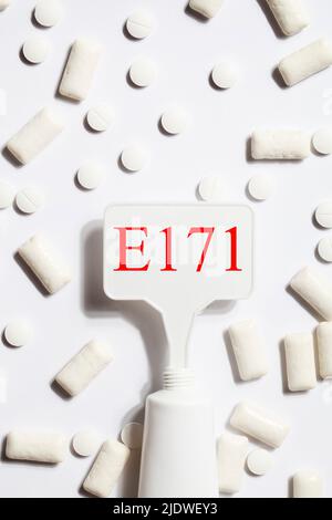 Titanium dioxide, E171, dangerous additive concept. gum, pills ...