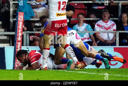 Konrad Hurrell #23 of St Helens looks to offload the ball to Tommy ...