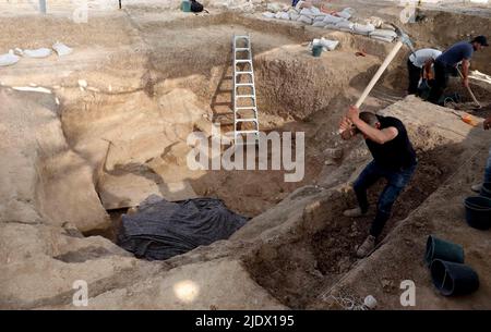 Rahat, Israel. 23rd June, 2022. People work around the relics of a ...