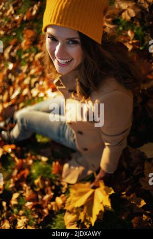 Hello november. smiling young woman in scarf with leather gloves ...