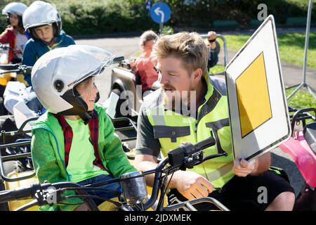 boy in protective helmet showing power gesture Stock Photo - Alamy