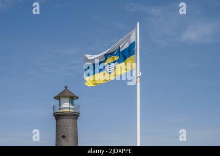 Germany, Lower Saxony, Juist, Flagpole in front of Memmertfeuer ...