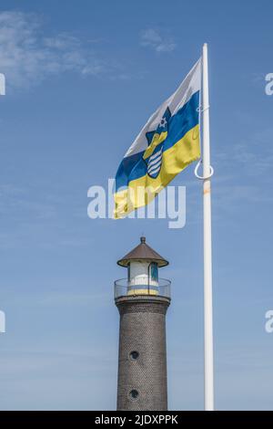 Germany, Lower Saxony, Juist, Flagpole in front of Memmertfeuer ...