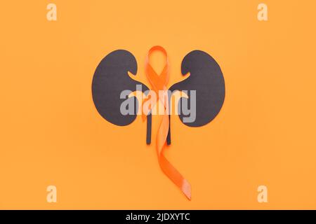 Orange awareness ribbon and paper kidneys on blue background Stock ...