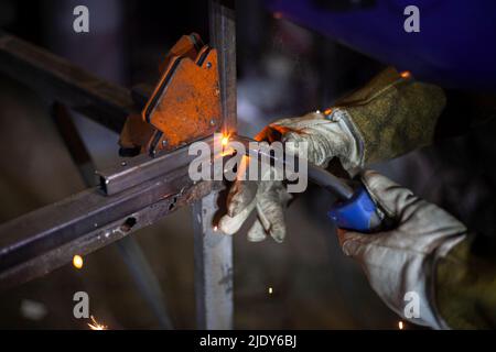 Metal welding. Fire from operation of welding machine. Manufacture of ...
