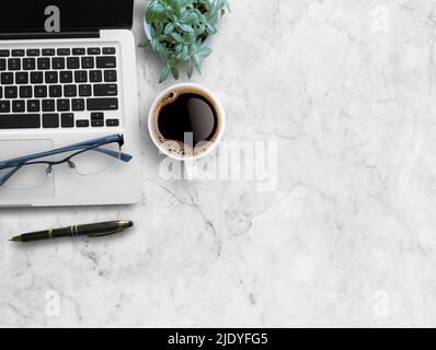 Top view blank notebook,glasses,pen,cup of coffee on wood table ...