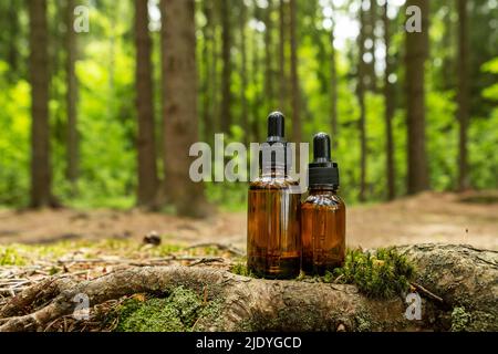 Cosmetic containers are located on natural forest background Stock ...