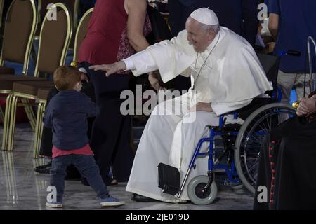 Pope Francis, seated in a wheelchair, delivers his speech during the ...