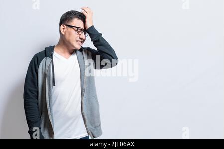 Picture of an stressful man touching his head Stock Photo - Alamy