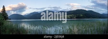 Evening atmosphere at Lake Weissensee, highest bathing lake in the Alps ...