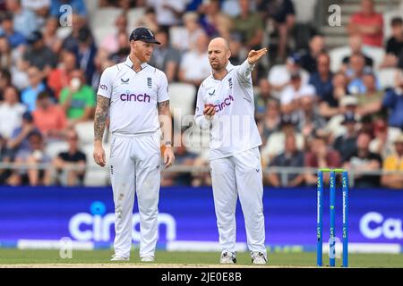 Jack Leach of England (R) instructs Ben Stokes of England on fielding ...