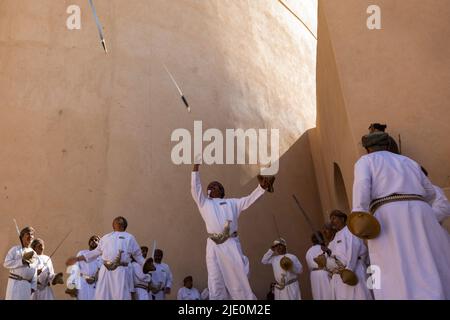 Traditional Omani Razha (or Azhi) sword dance performed by men in ...