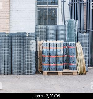 Barbed wire and metal grid by rhe construction market shop Stock Photo ...