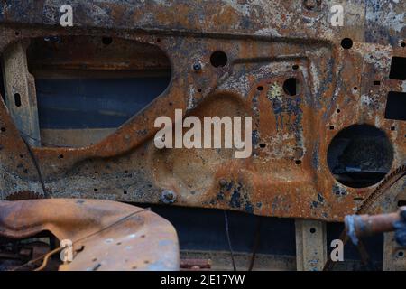 Burnt old rusty car parts. Looting, arson and terrorism Stock Photo - Alamy