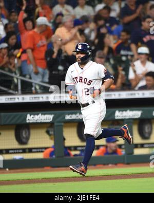 Houston Astros' Jose Altuve hits a sacrifice fly, scoring a run, off ...