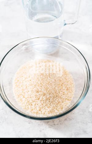 Measured ingredients in glass mixing bowls to bake meringue cookies ...