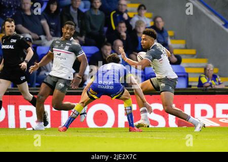 Darnell Mcintosh #5 of Hull FC hands off Stefan Ratchford #1 of ...