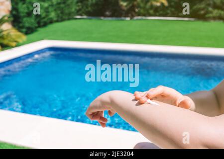 Sunburn and skin care concept. Young woman with red sunburned skin on ...