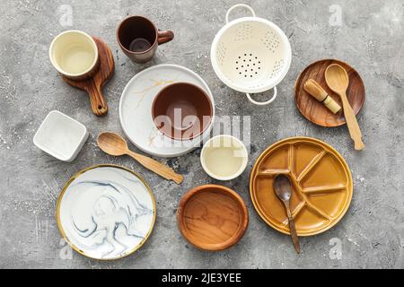 Different dinnerware on grunge background, closeup Stock Photo - Alamy