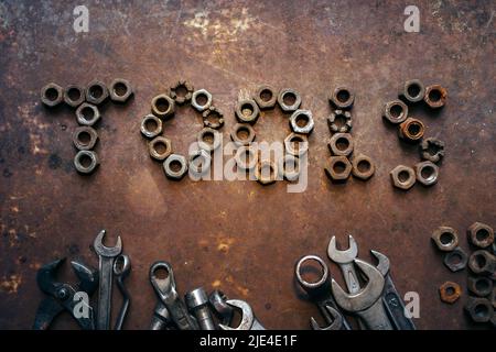 the word Tools written by nuts and a set of wrenches Stock Photo - Alamy