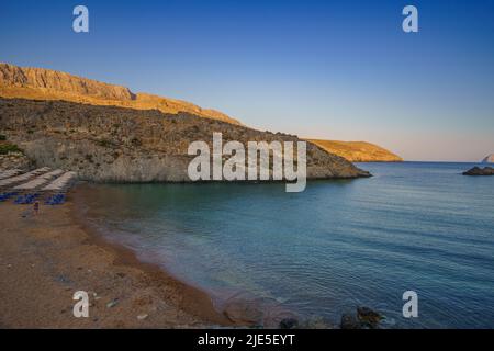 The famous rocky beach Melidoni at sunset. Amazing scenery with crystal ...