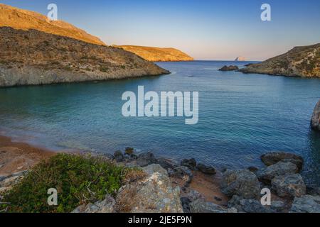 The famous rocky beach Melidoni at sunset. Amazing scenery with crystal ...