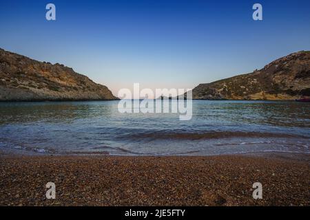 The famous rocky beach Melidoni at sunset. Amazing scenery with crystal ...