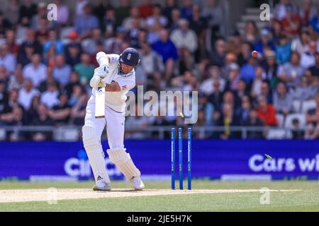 Stuart Broad of England is bowled out by Tim Southee of New Zealand ...