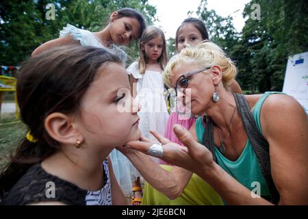 People attend an event to mark World Refugee Day, in Zagreb, Croatia ...
