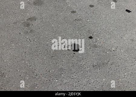 a highway with oil stains on the surface, a polluted highway from ...