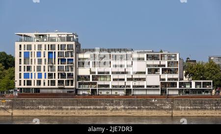 Prominent residential building standing on riverbank of Rhine river in ...