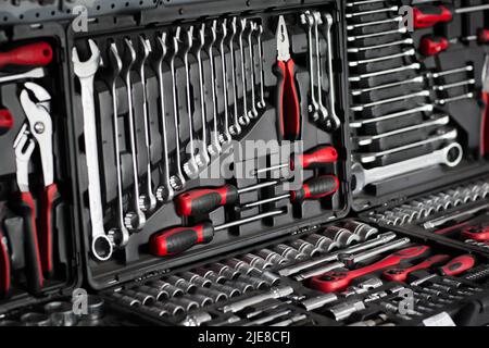 Tools and toolbox on the shop (store) showcase. Many wrench and nuts in ...
