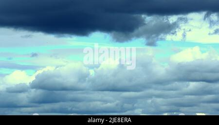 Swirling evening clouds illuminated by the setting sun Stock Photo - Alamy